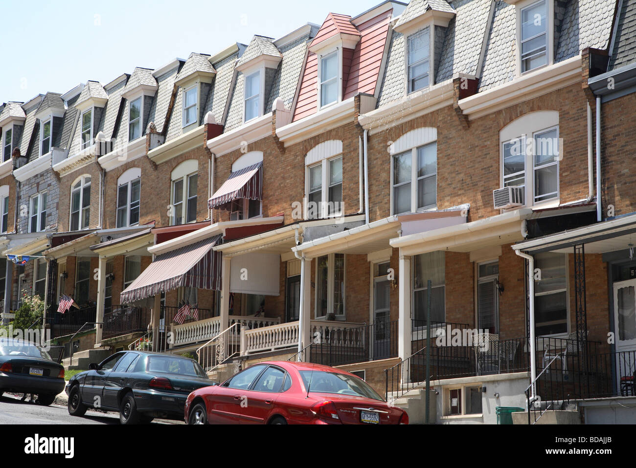 Section of row of flat roofed brick built Victorian style terrace ...