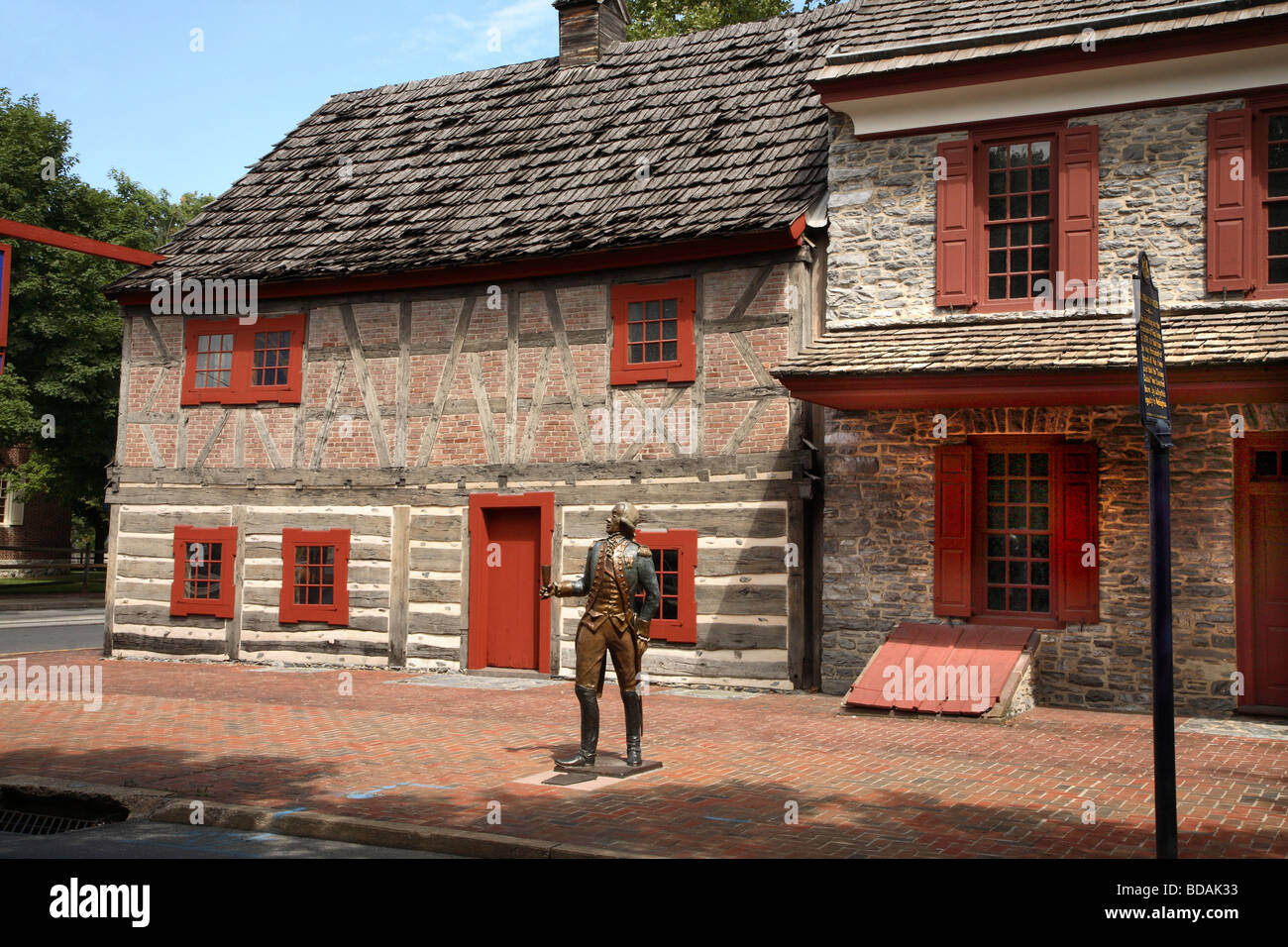 Golden Plough Inn with a bronze statue of Marquis de Lafayette on brick ...