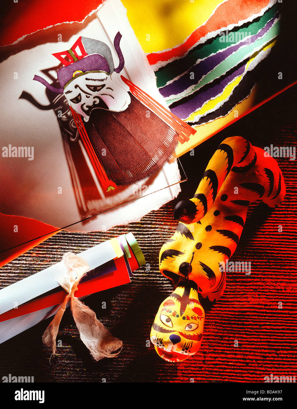 Conceptual still life shot using origami paper Chinese cut-outs and a ...