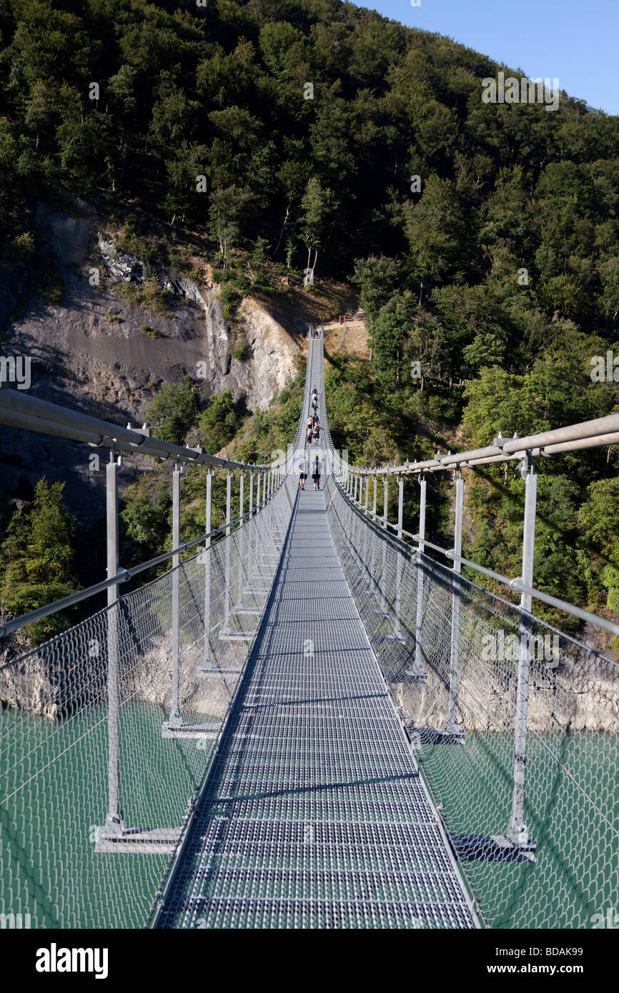 walkers crossing the passerelle de l'ebron, a himalayan style ...