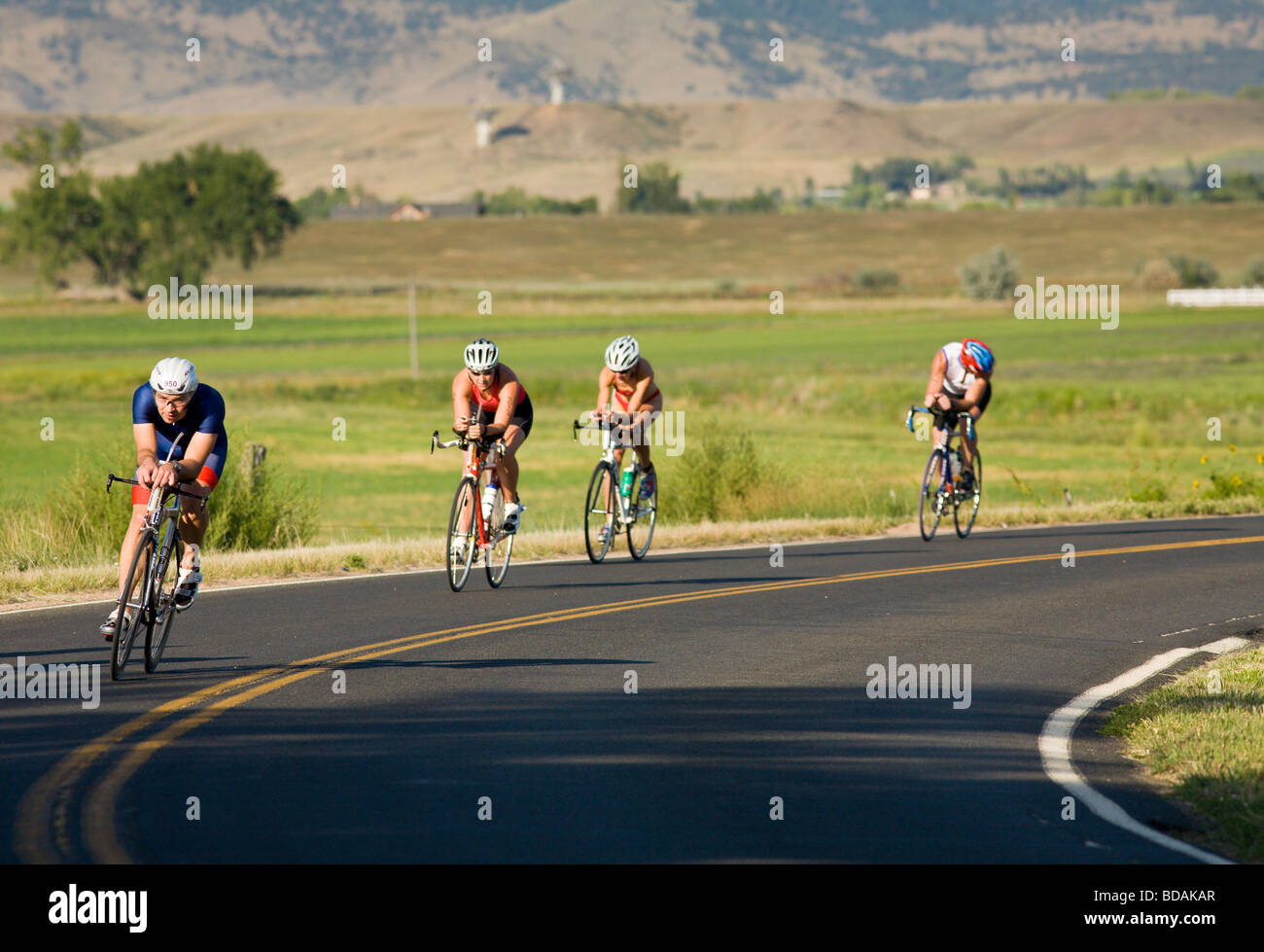 Triathletes compete in the bike leg of the 5430 Triathlon in Boulder ...