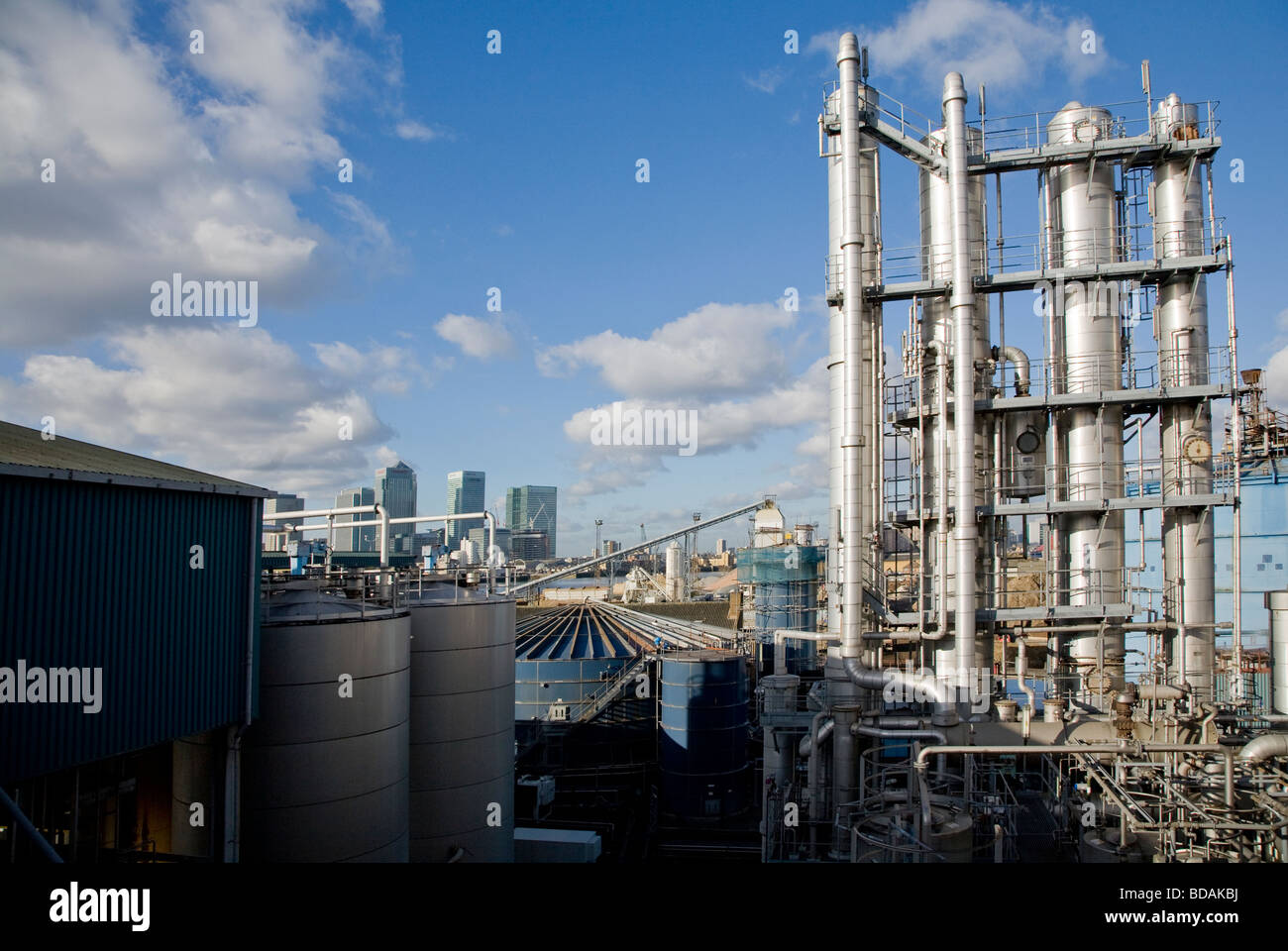 Syral UK s Greenwich neutral grain distillery with the towers of Canary ...