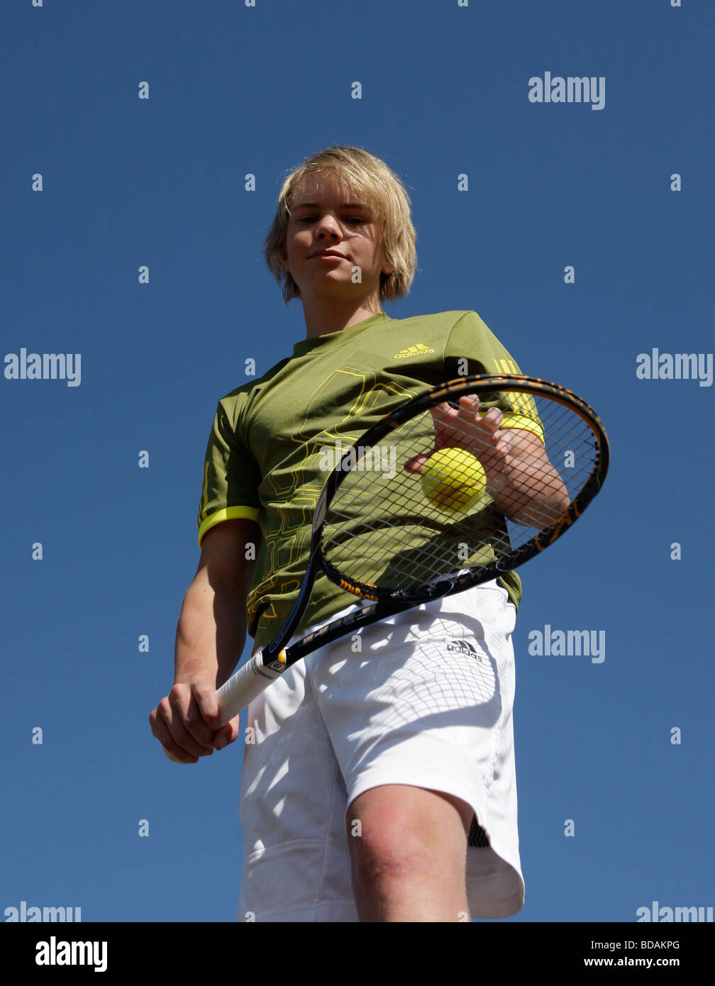 Young tennis player about to serve,view from below Stock Photo - Alamy