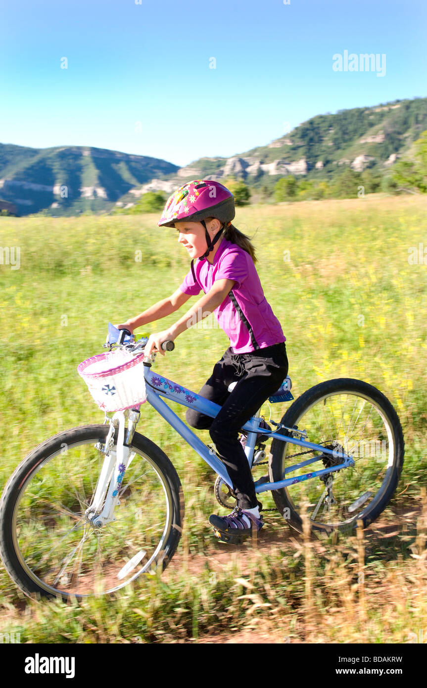 Girl mountain biking Stock Photo - Alamy