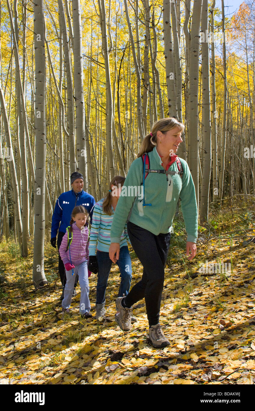 Family hiking in Fall colors Stock Photo - Alamy