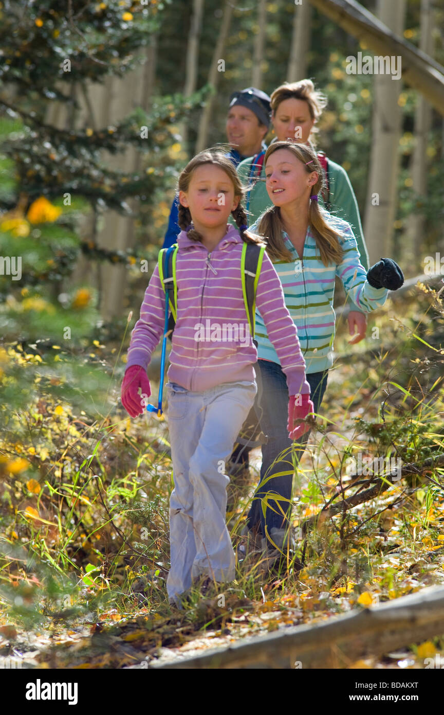 Family hiking in Fall colors Stock Photo - Alamy