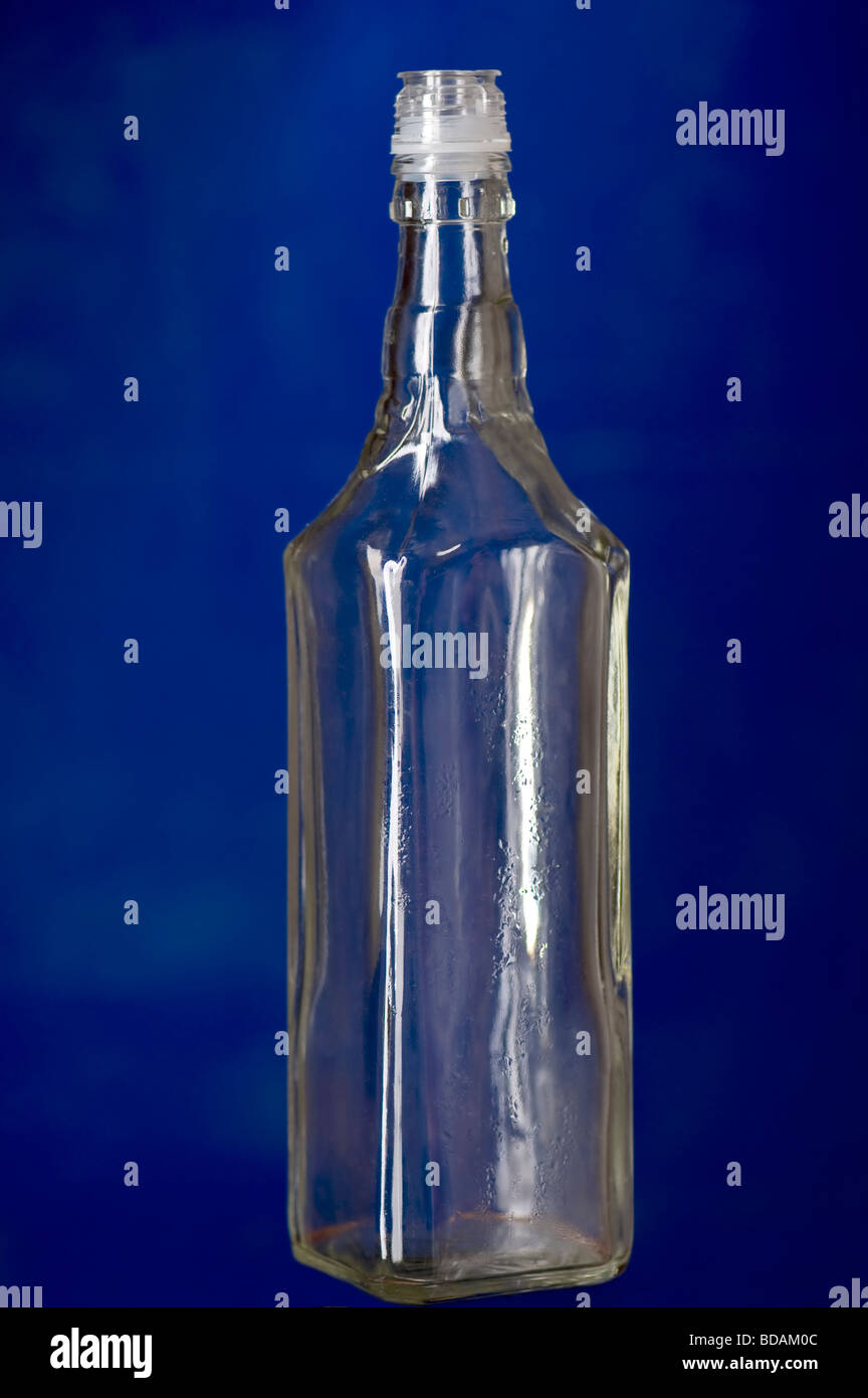 object on blue Glass bottle close up Stock Photo - Alamy
