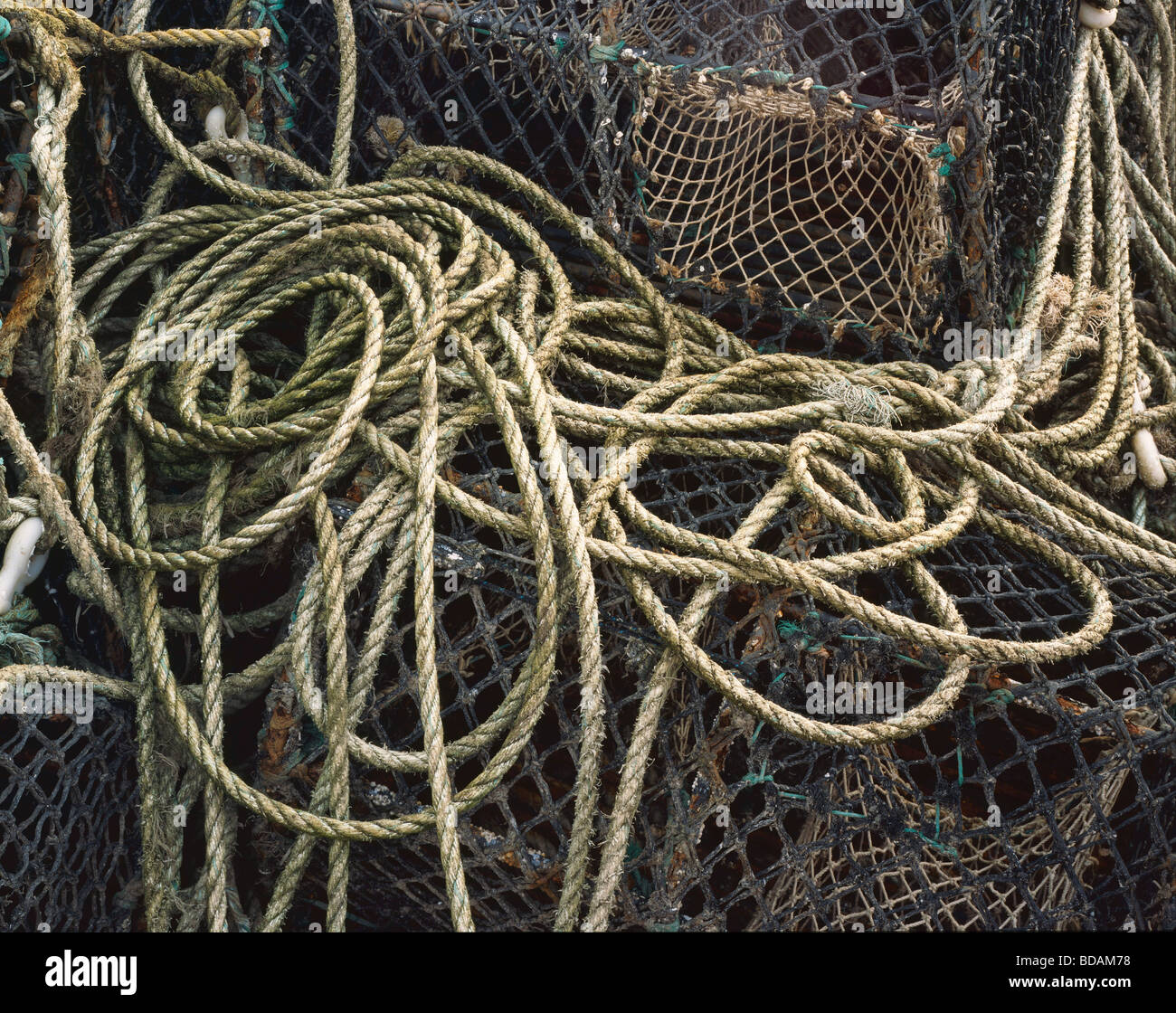 Creels and coiled fishing ropes on the pier at Tobermory, Isle of Mull ...