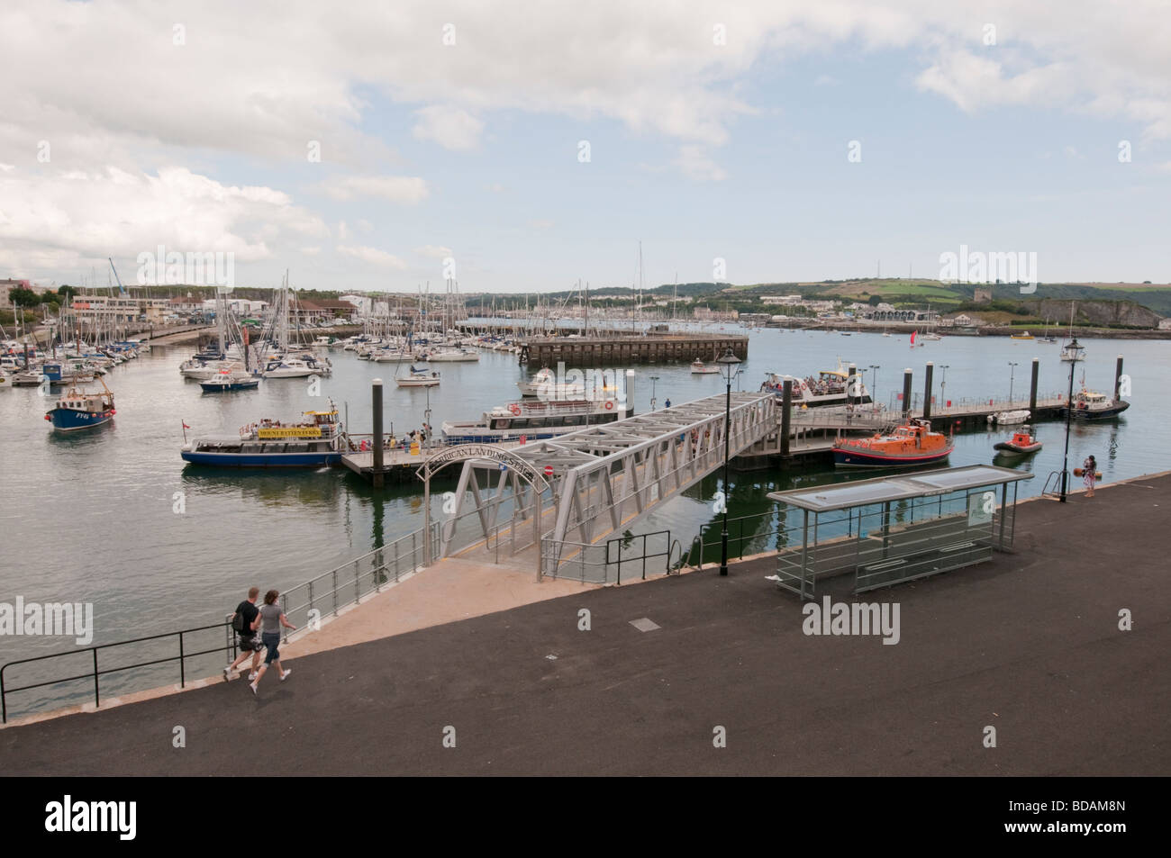 Pleasure boats, jetty red, water landing stage Stock Photo - Alamy