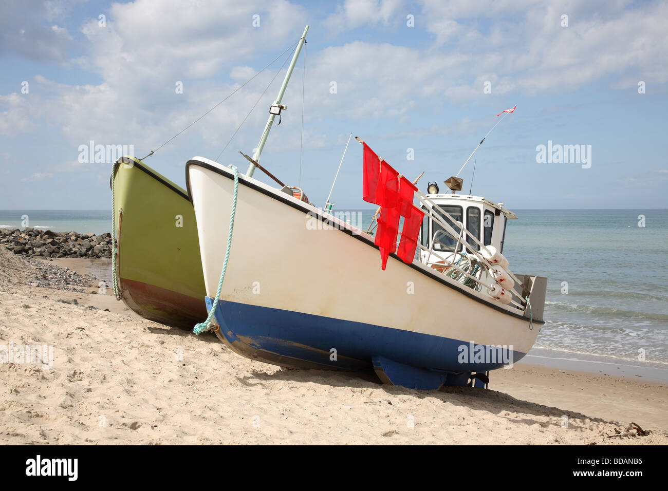 Danish fishing boats pulled up by a winch on the beach at Lønstrup ...