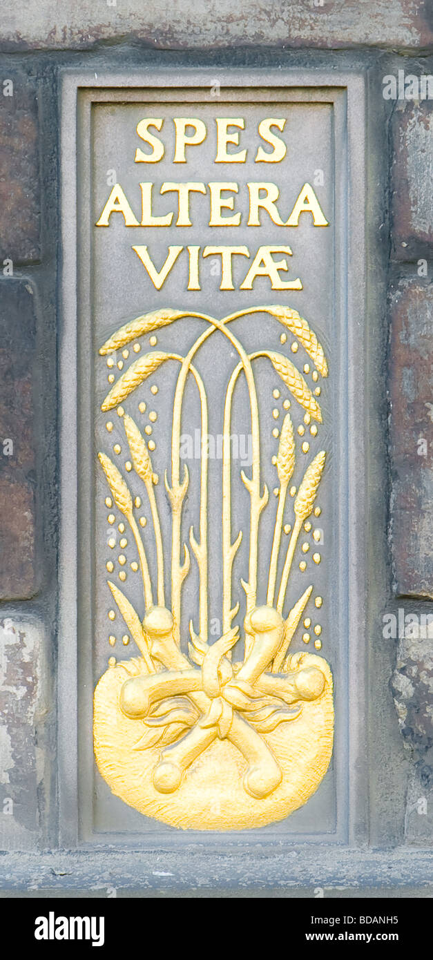 Latin inscription panels set in ancient stone walls. The Latin script ...