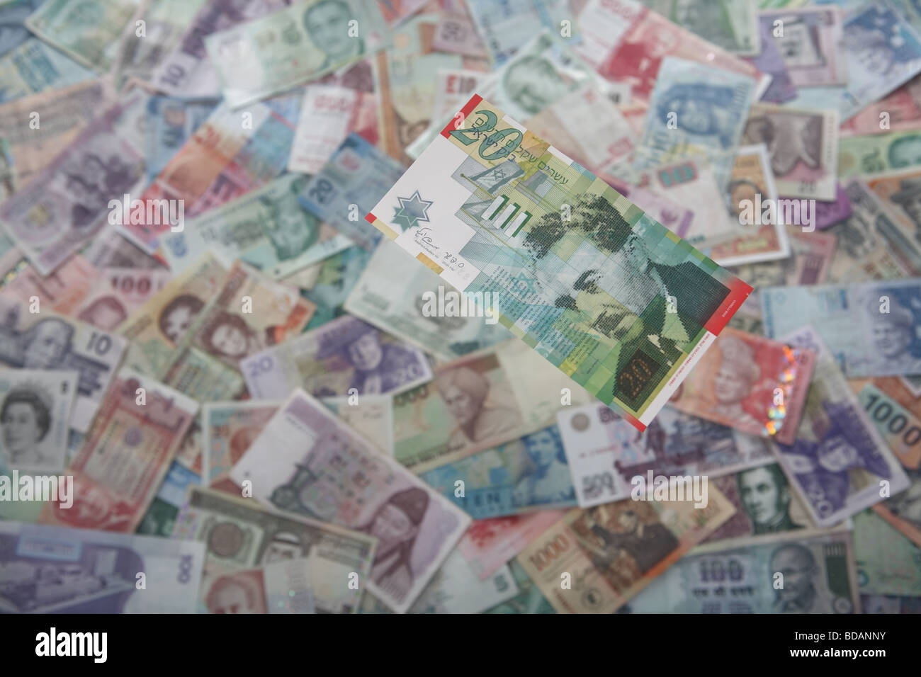An Israeli Shekel on a soft background of international currencies ...