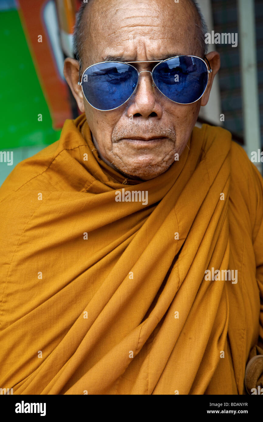 A Thai monk with amazing blue sun glasses Stock Photo - Alamy