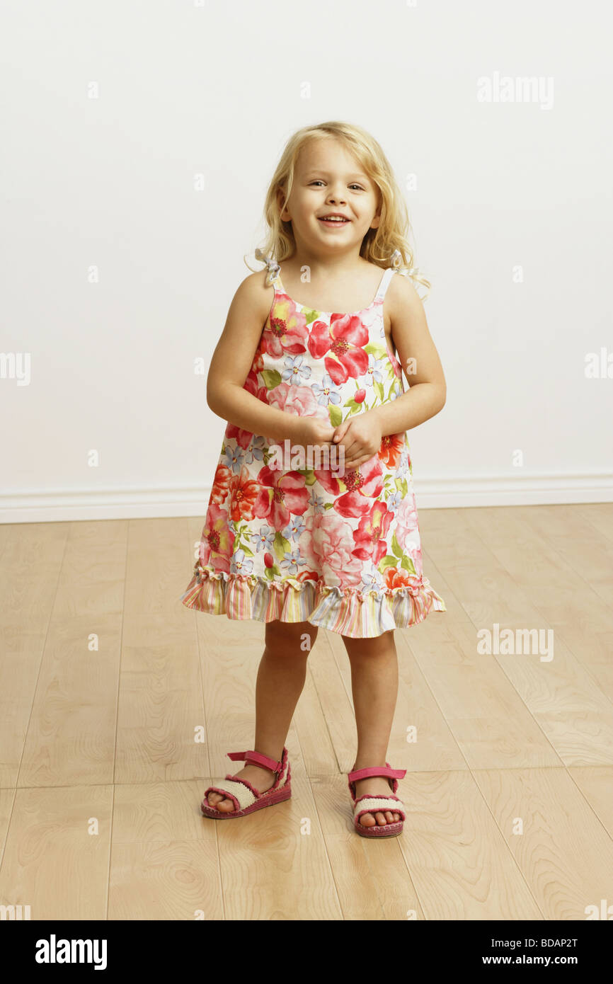 Portrait of a girl standing and smiling Stock Photo - Alamy