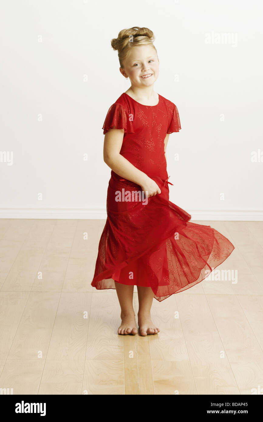Portrait of a girl standing and smiling Stock Photo - Alamy