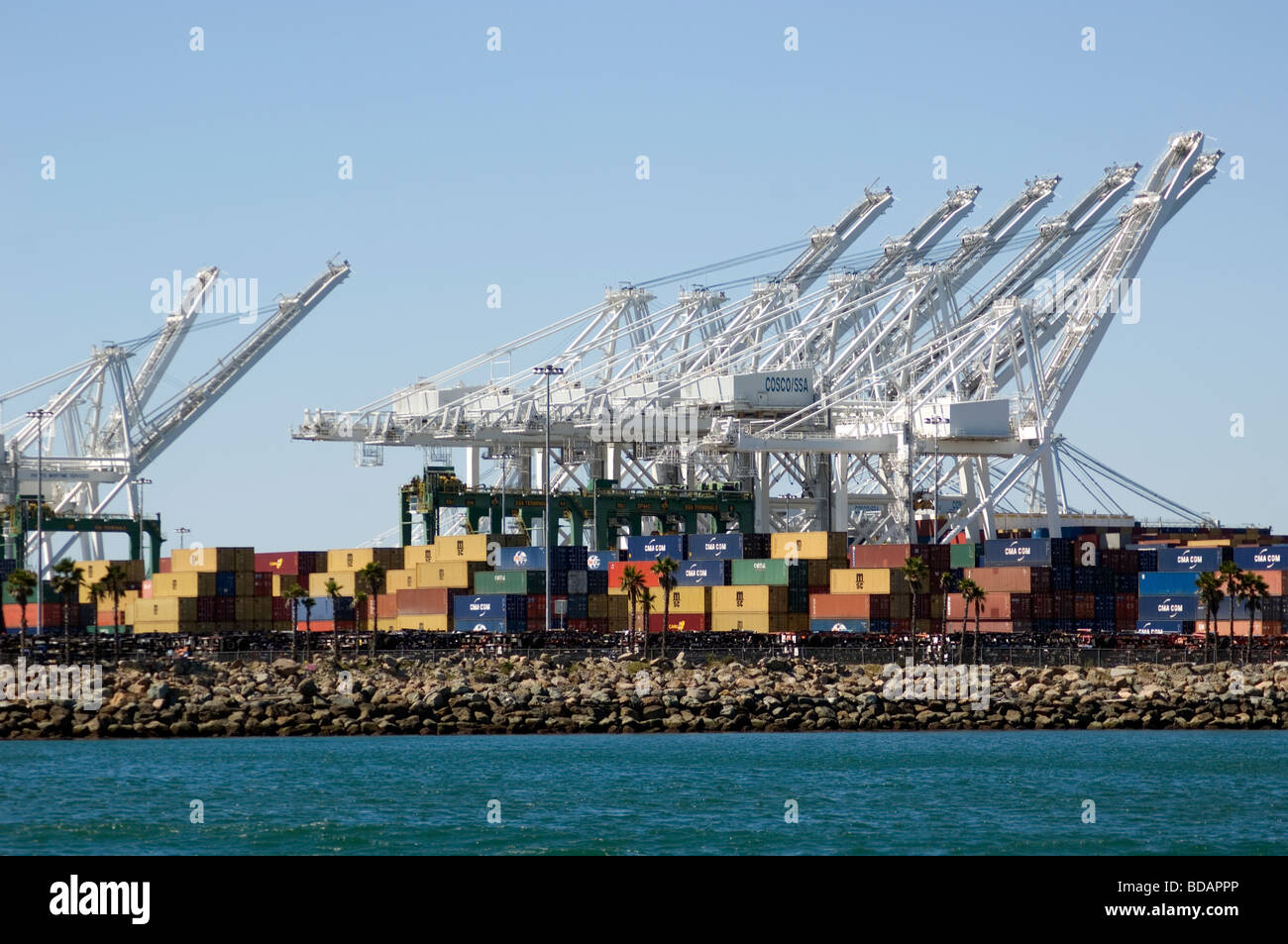 Loading dock with cranes and shipping containers Stock Photo - Alamy