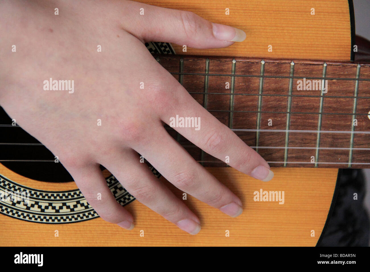 Guitar and hand Stock Photo - Alamy