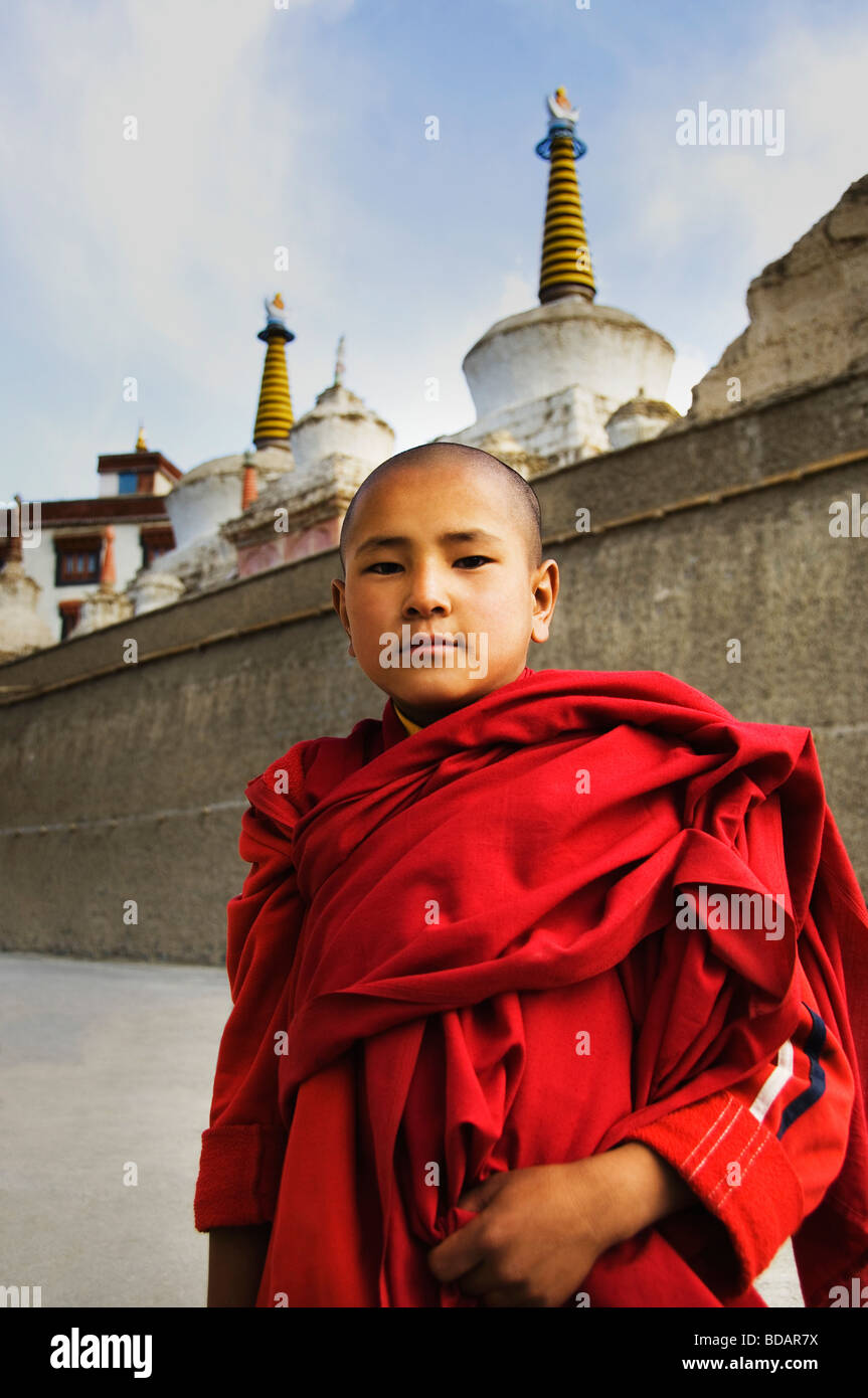 Child monk standing in front of a monastery, Lamayuru Monastery, Ladakh ...