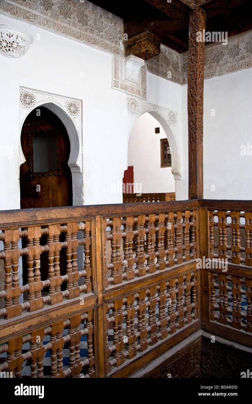 Heavily carved timber balconies in the Medersa Ben Youssef in the ...