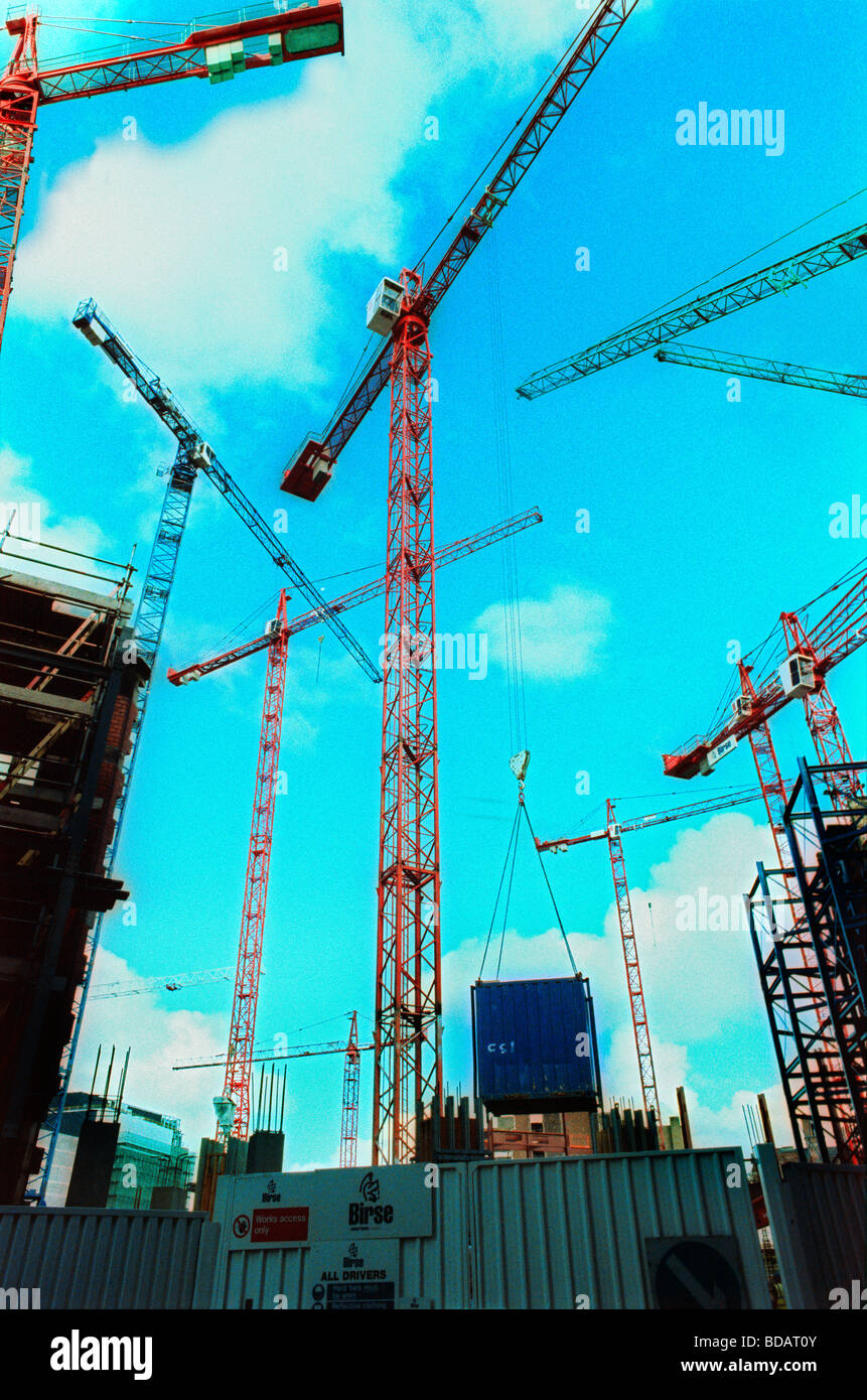 Building cranes on a construction site Stock Photo - Alamy