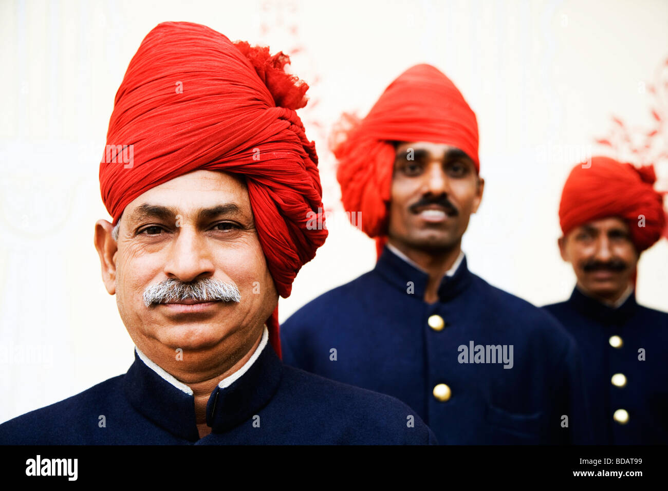 Portrait of three men wearing guard uniform Stock Photo - Alamy