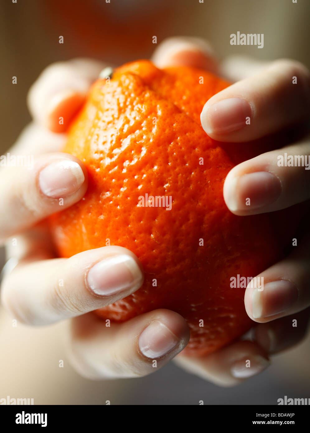 Orange palms of the girl with a nice manicure Stock Photo - Alamy