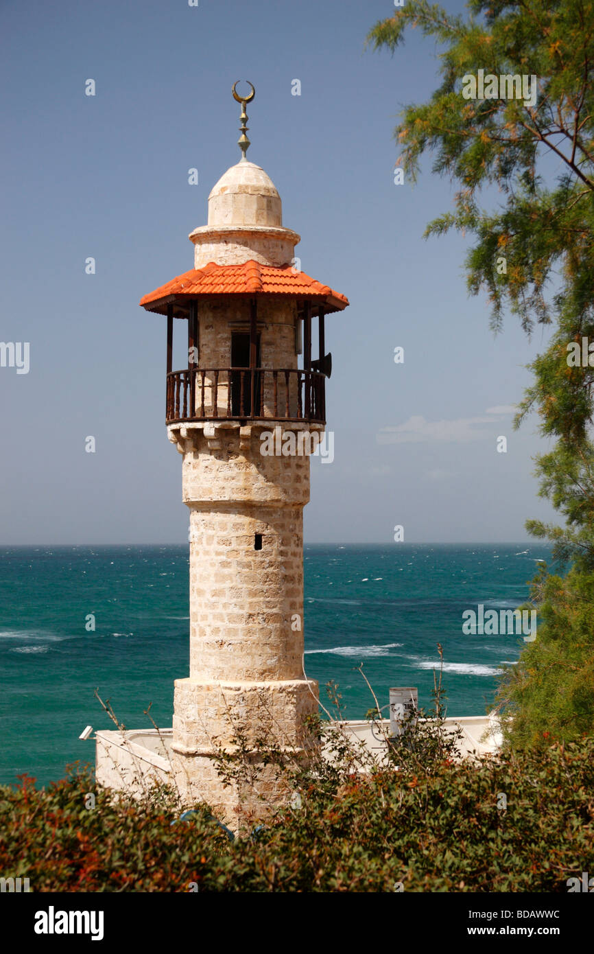 Minaret of mosque with sea behind Stock Photo - Alamy