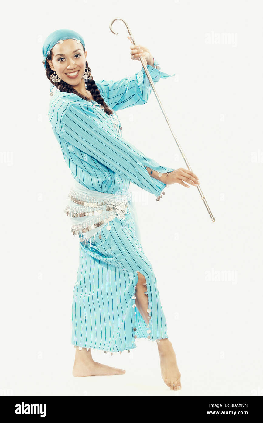 Portrait of a female dancer holding a cane and smiling Stock Photo - Alamy