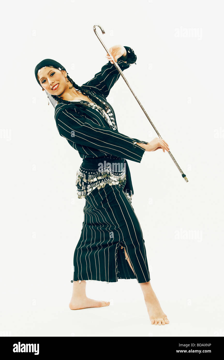 Portrait of a female dancer holding a cane and smiling Stock Photo - Alamy