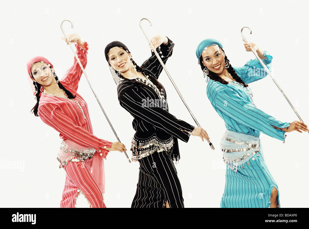 Portrait of three female dancers holding canes and dancing Stock Photo ...