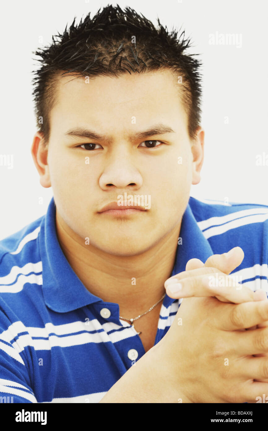 Portrait of a young man looking serious Stock Photo - Alamy