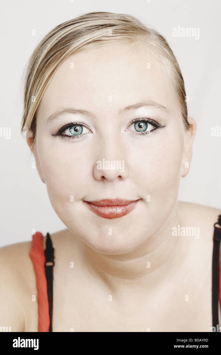 Portrait of a young woman grinning Stock Photo - Alamy