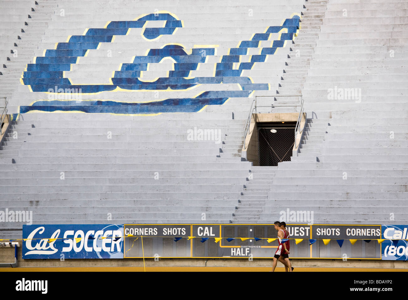 Track competitors walk under the Cal logo at Edwards Stadium at the ...