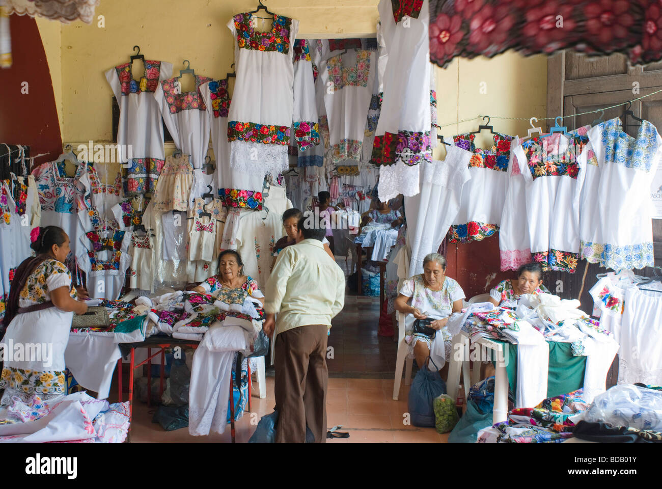 Women embroider and sell dresses typical of the indigenous Mayan of the ...