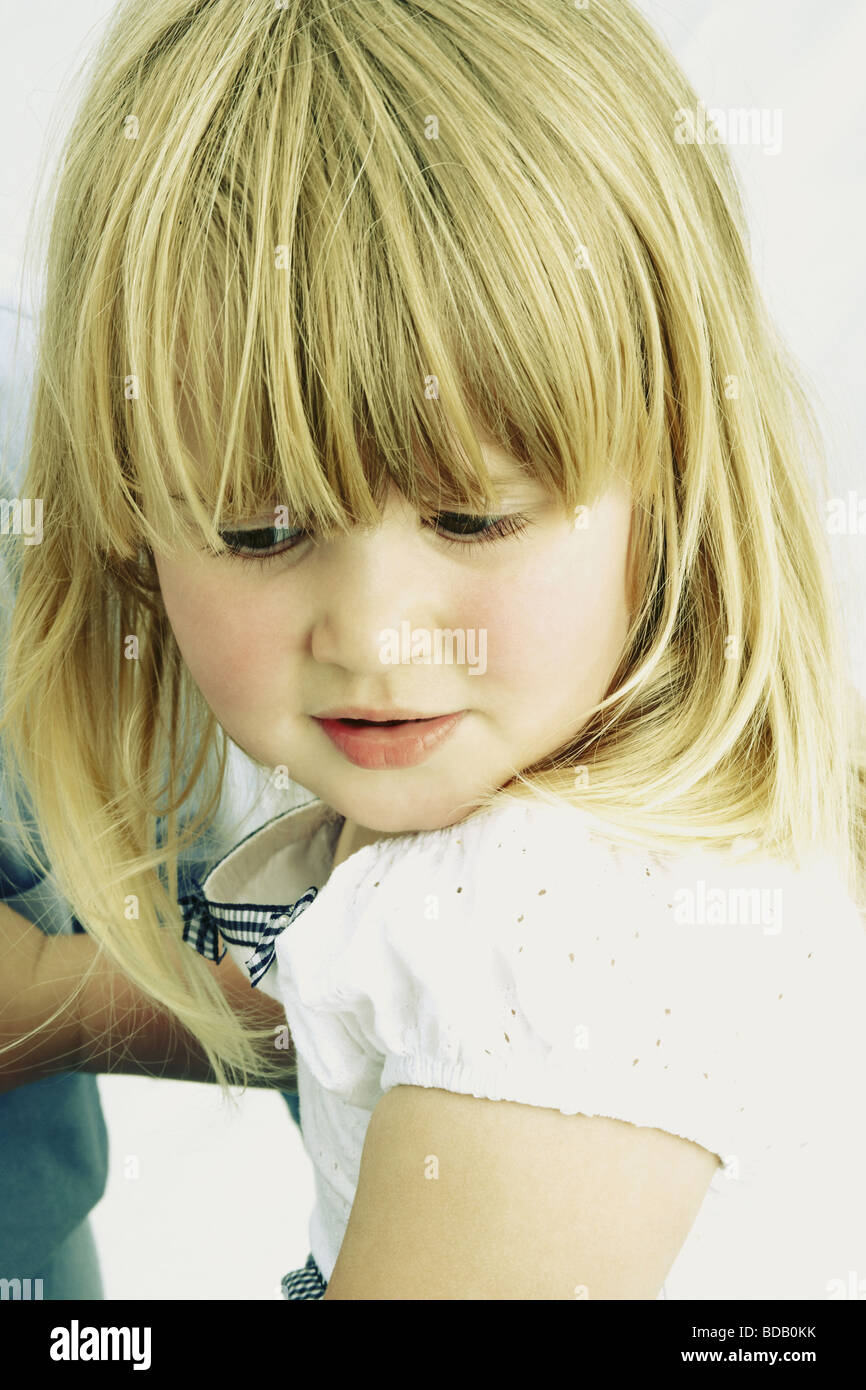 Side profile of a girl looking down Stock Photo - Alamy