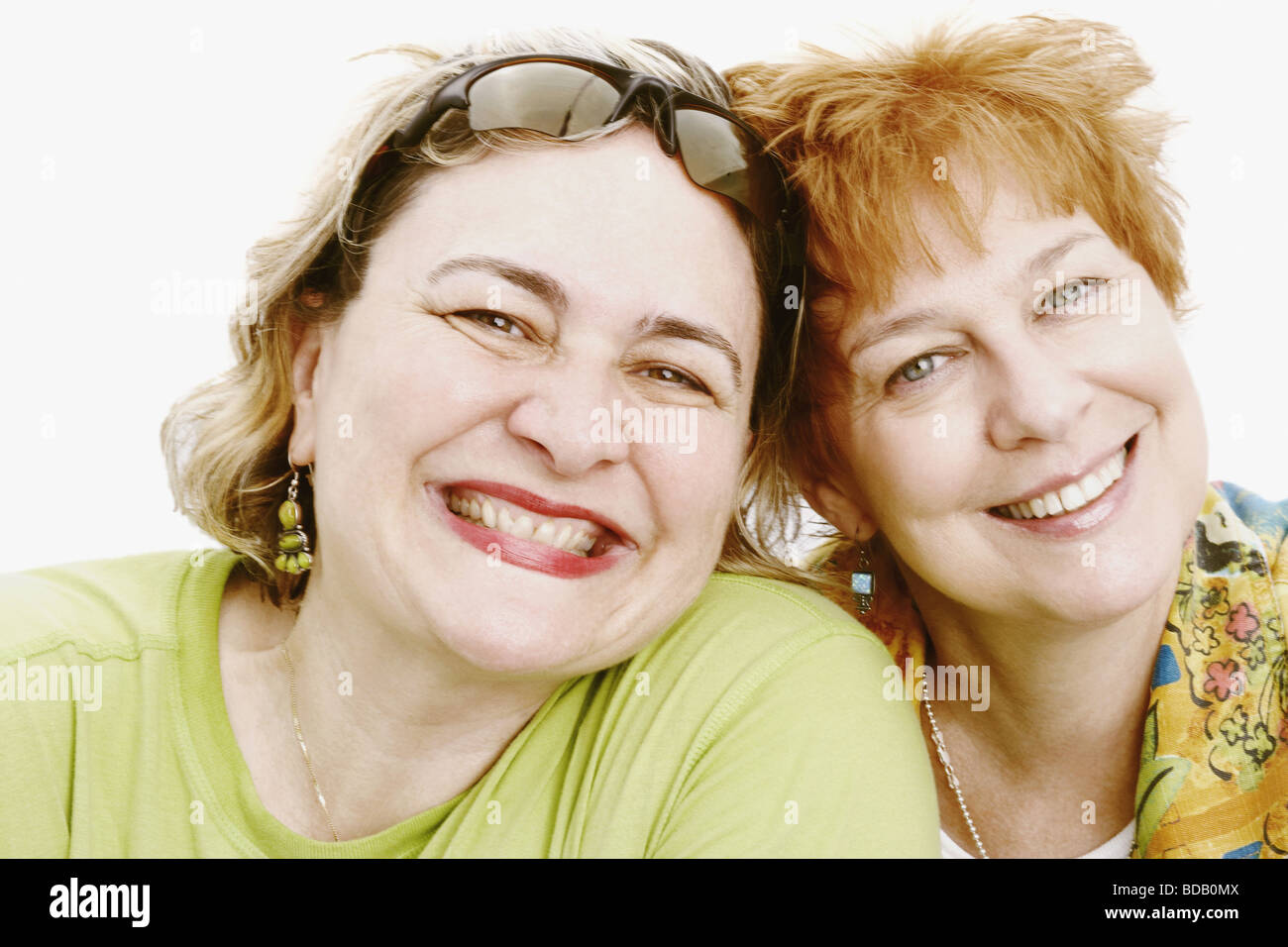 Portrait of two mature women smiling Stock Photo - Alamy