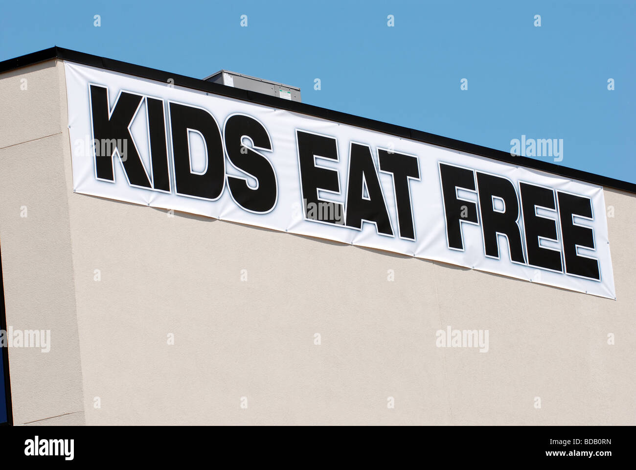 Kids eat free sign Stock Photo - Alamy