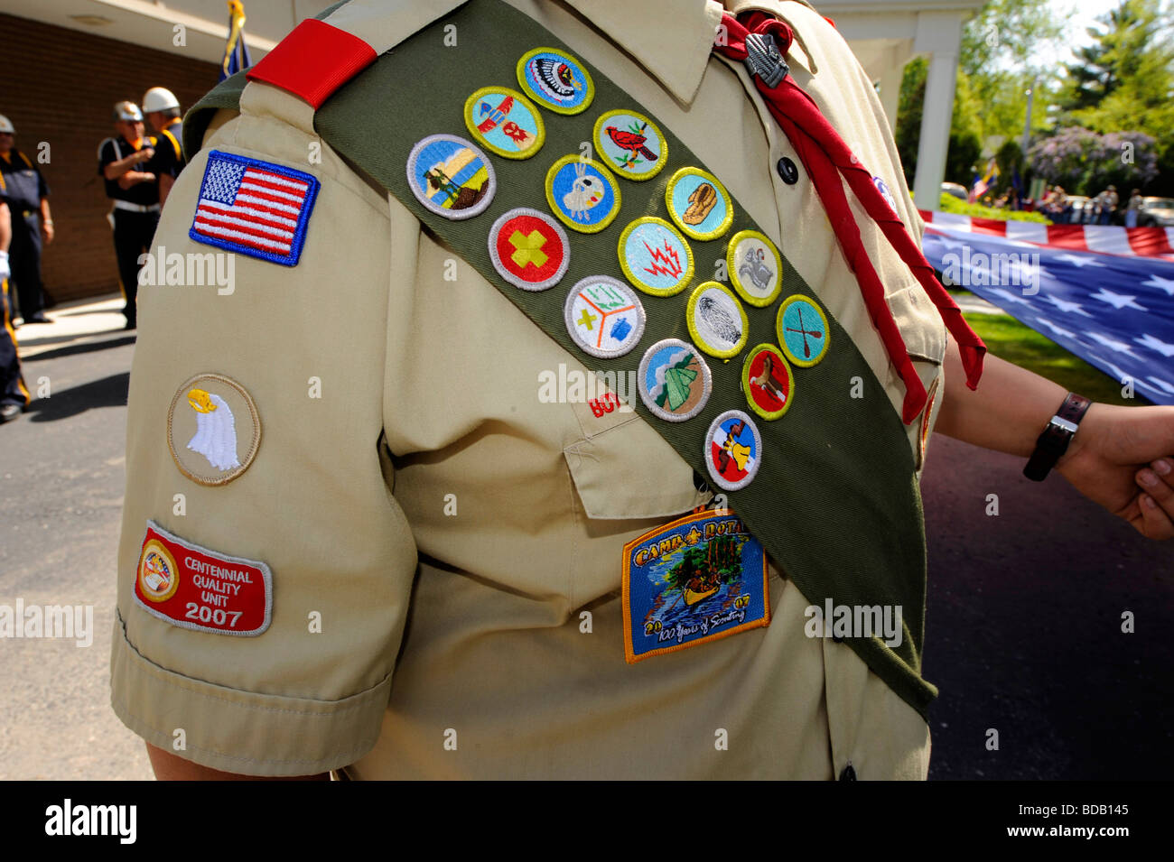Boy scout in uniform with merit badges Stock Photo - Alamy