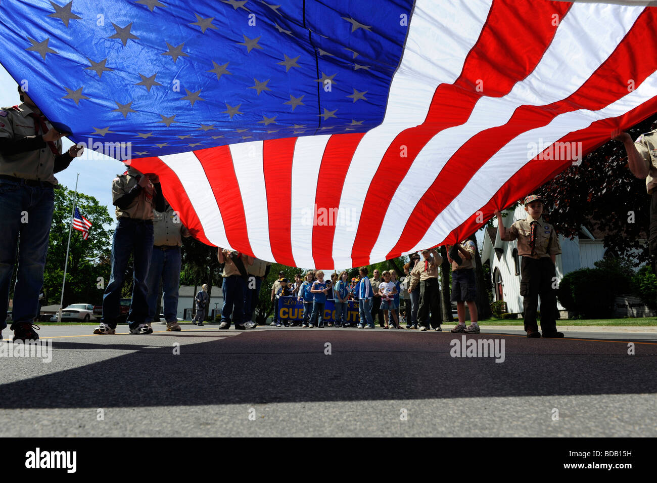 Cub Scouts carry large American flag in Memorial Day parade Stock Photo ...