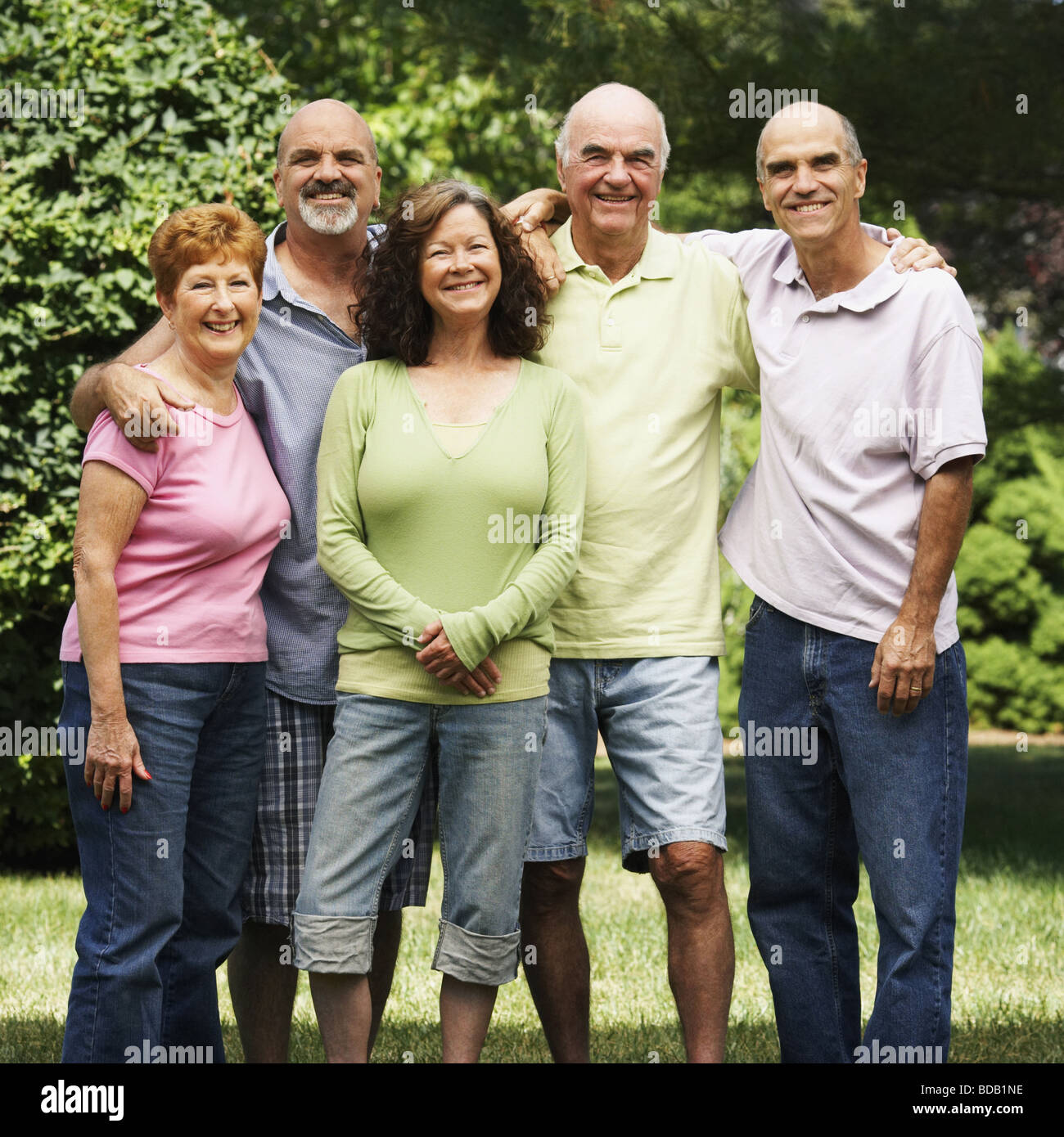 Friends standing in a park Stock Photo - Alamy