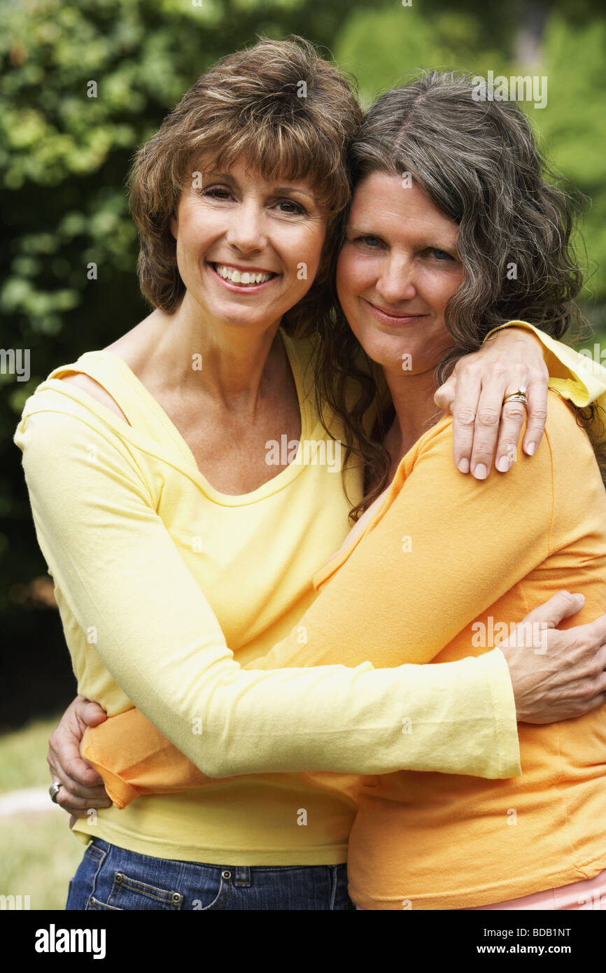 Portrait of two mature woman smiling Stock Photo - Alamy