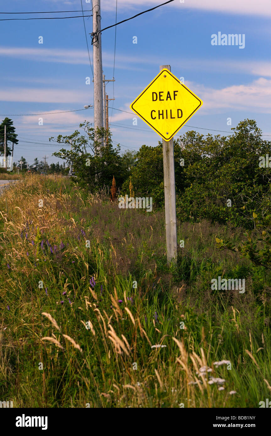 Yellow roadside caution sign for Deaf Child in Nova Scotia Stock Photo ...