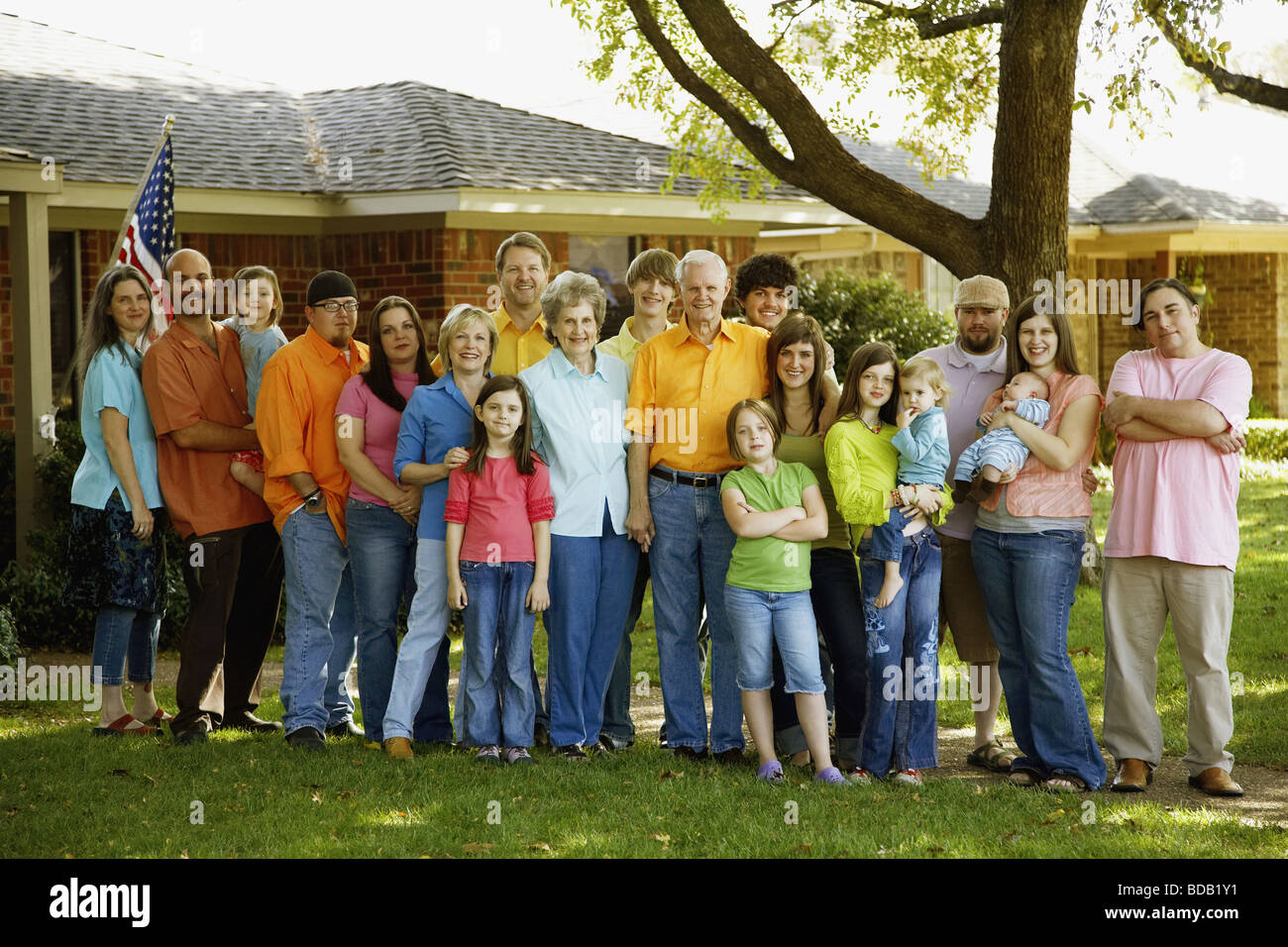 Portrait of a family standing together in front of a house Stock Photo ...