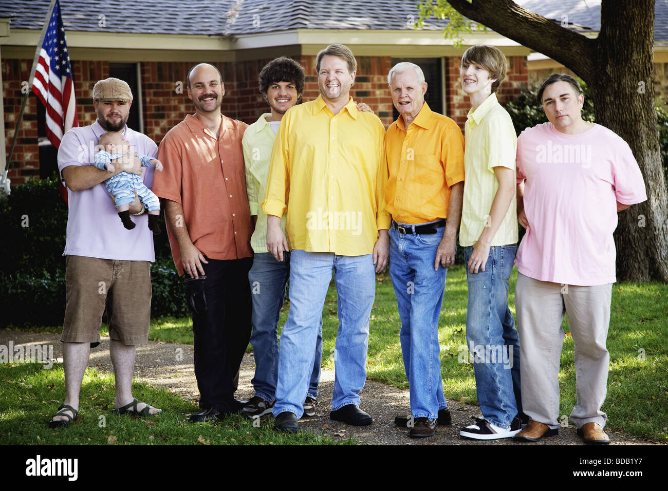 Family standing in front of house hi-res stock photography and images ...
