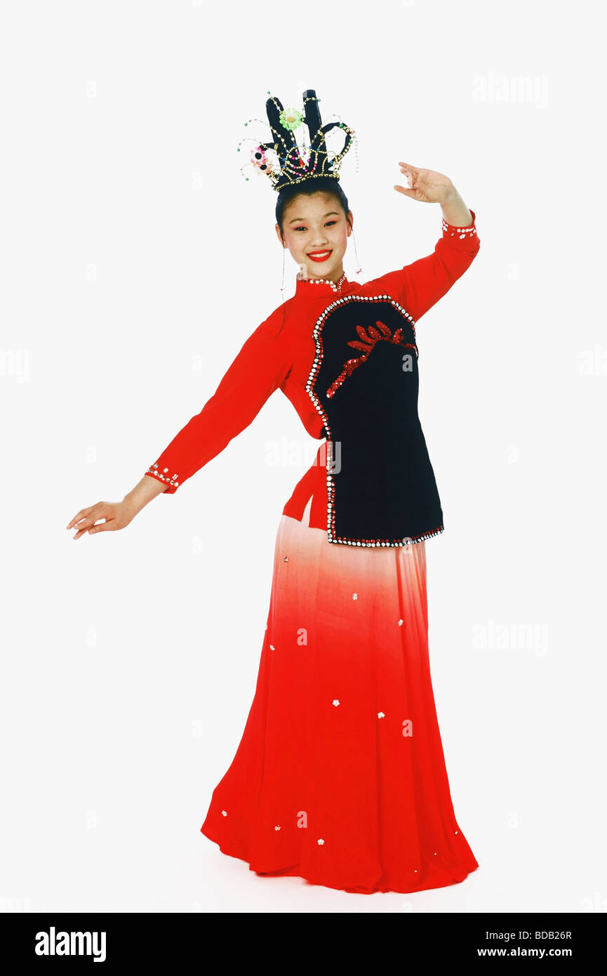 Portrait of a girl in traditional clothing and performing folk dance ...
