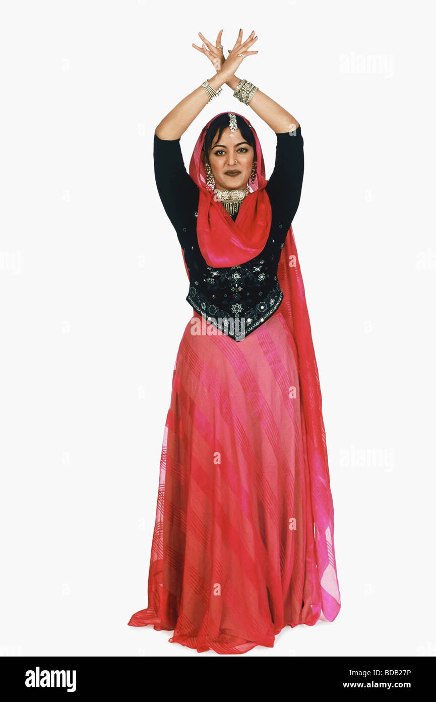 Portrait of a young woman performing folk dance Stock Photo - Alamy