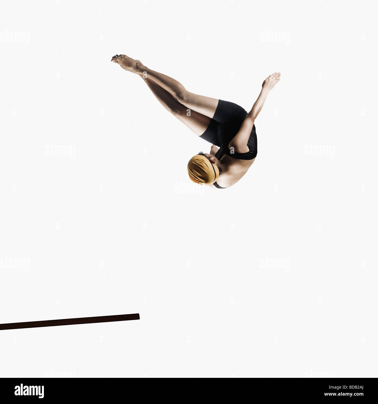 Young woman diving from a diving board Stock Photo - Alamy