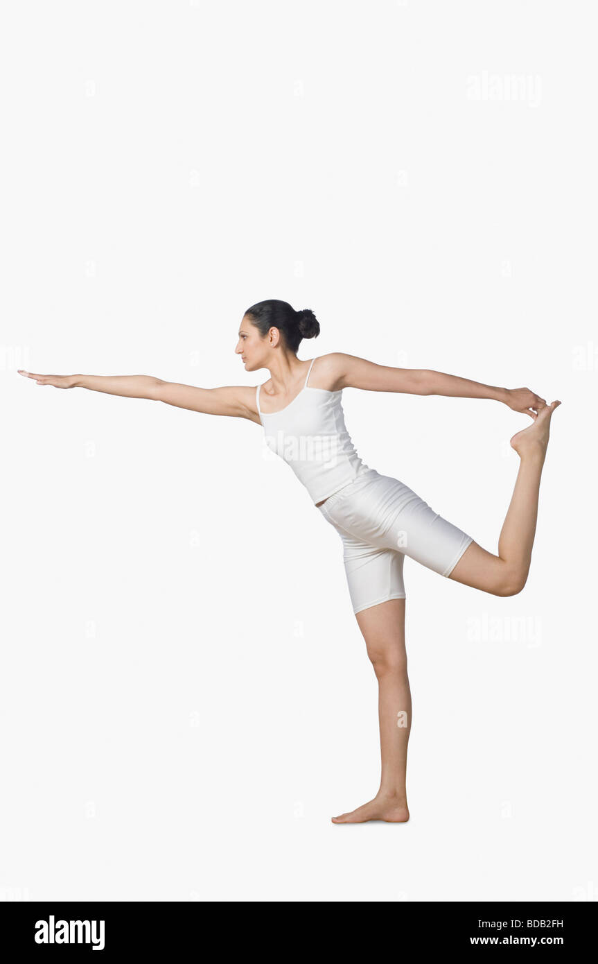 Young woman doing stretch exercise Cut Out Stock Images & Pictures - Alamy