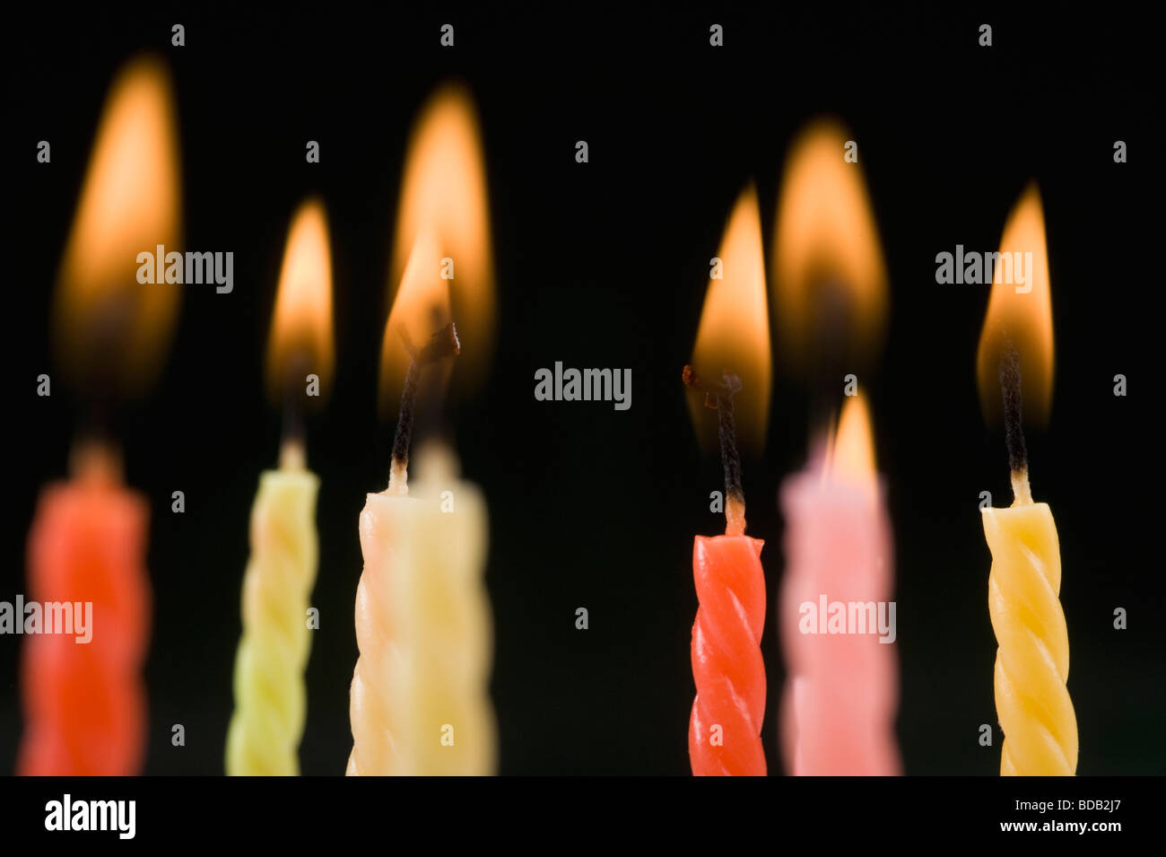 Close-up of burning birthday candles Stock Photo - Alamy