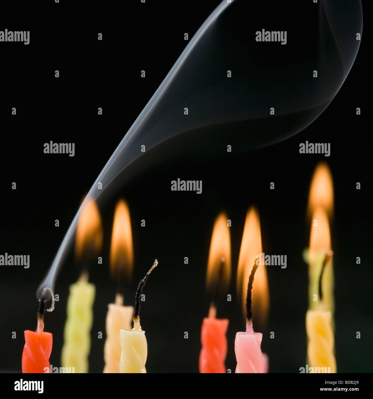 Close-up of burning birthday candles with an extinguished candle Stock ...